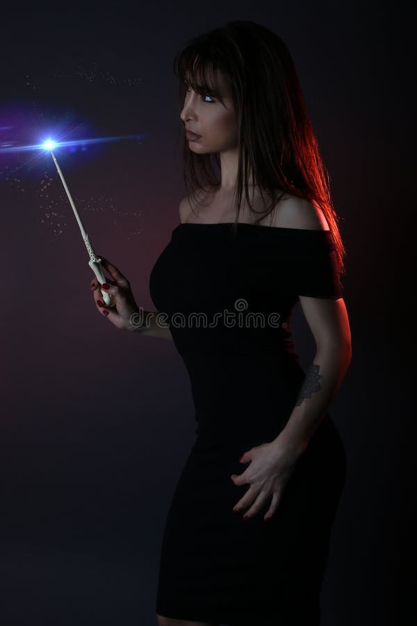 Young Wizard Holding a Magic Wand Stock Image - Image of witchcraft ...