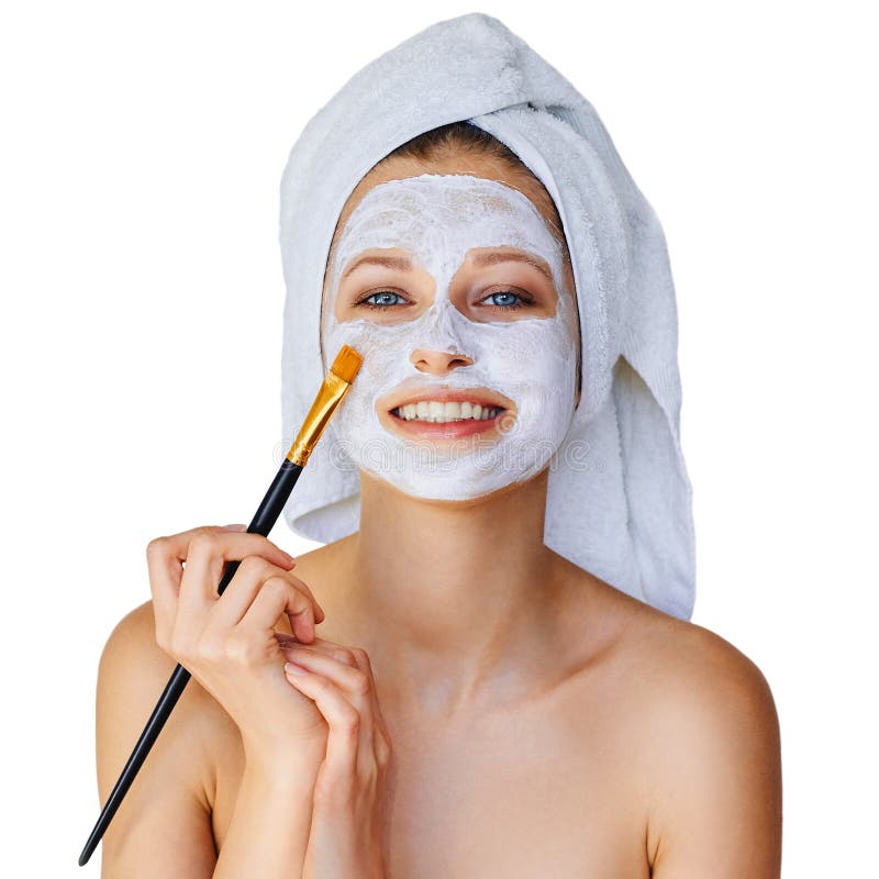 Beautiful Young Woman Applying Facial Mask On Her Face With Brush Skin
