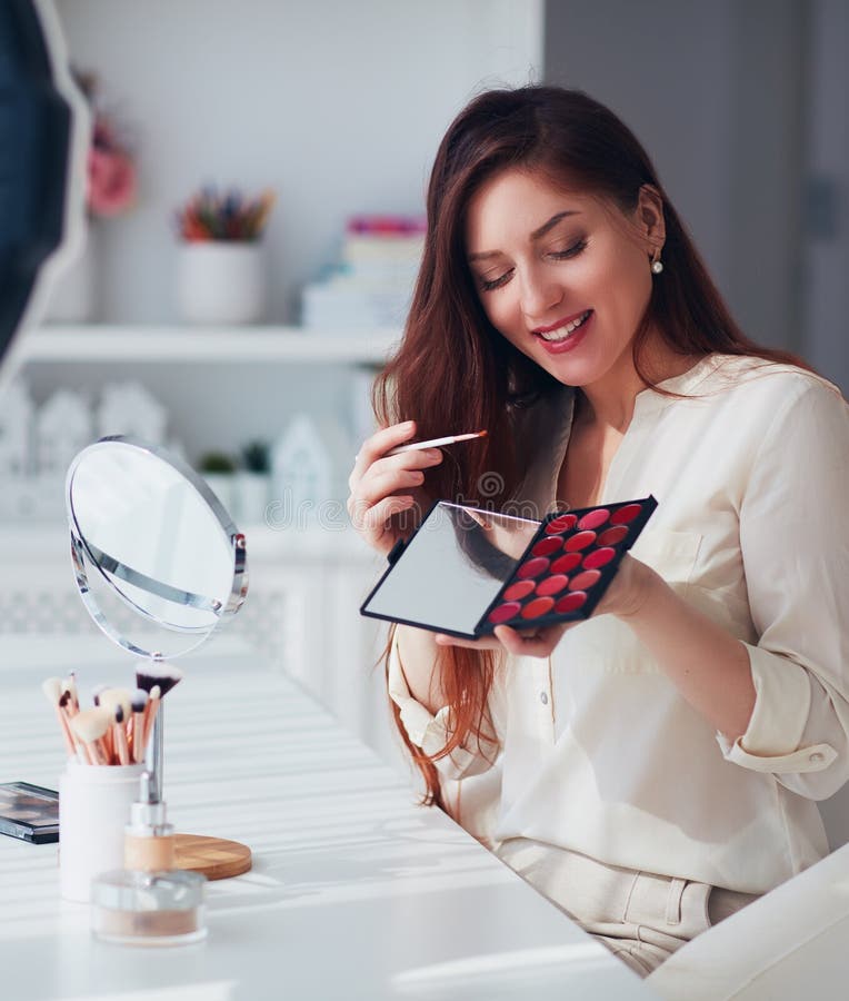 Beautiful Young Woman Applying a Makeup on at Home Stock Image - Image ...