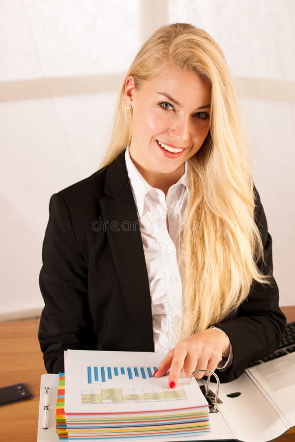 Beautiful Young Woman Check Data in a Work Folder in Her Office Stock ...