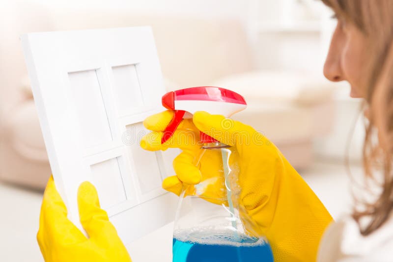 Beautiful Young Woman Cleaning Frame Stock Photo - Image of indoors ...