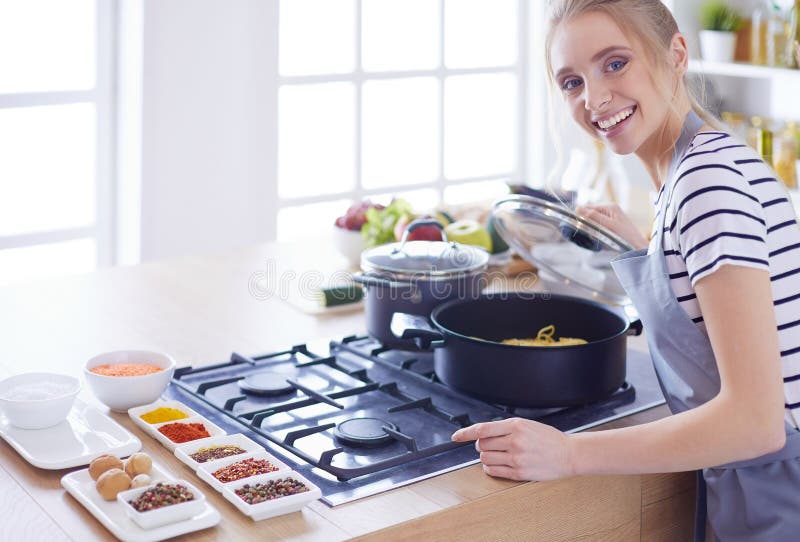 Beautiful Young Woman Cooking in Kitchen at Home Stock Photo - Image of ...