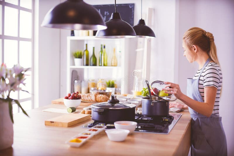 Beautiful Young Woman Cooking in Kitchen at Home Stock Photo - Image of ...