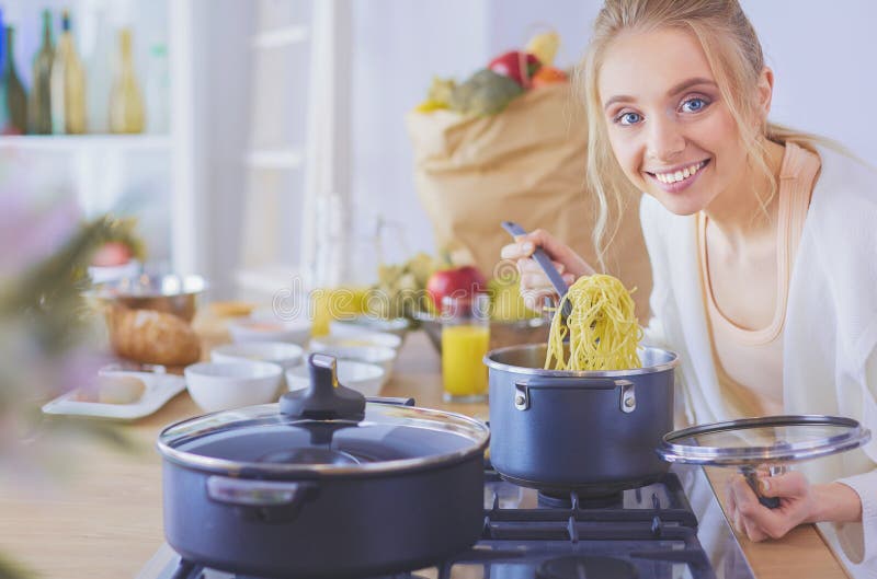 Beautiful Young Woman Cooking in Kitchen at Home Stock Photo - Image of ...
