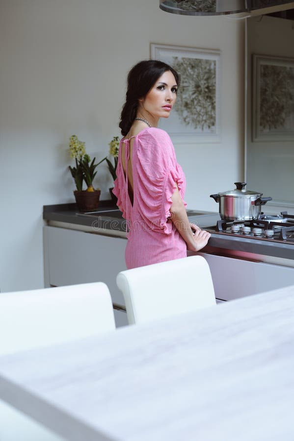 Beautiful Young Woman Cooks Dinner in Her Kitchen Stock Image - Image ...