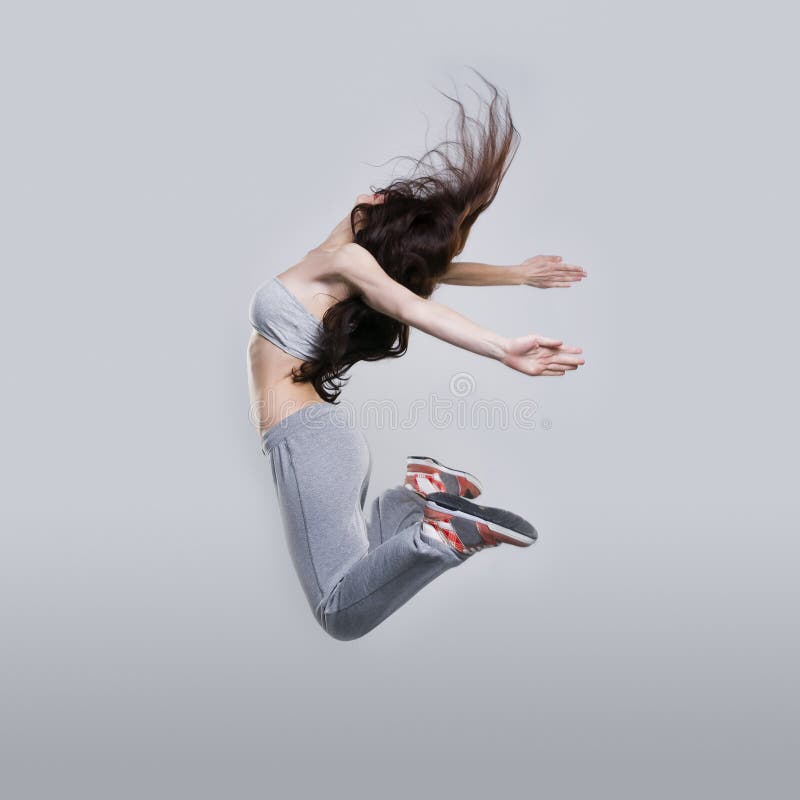 Beautiful Young Woman Dancer Jumping in Studio Stock Image - Image of ...