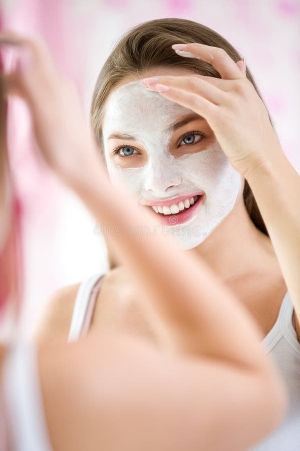 Beautiful Young Woman Doing Cosmetic Mask on Her Face Stock Photo ...