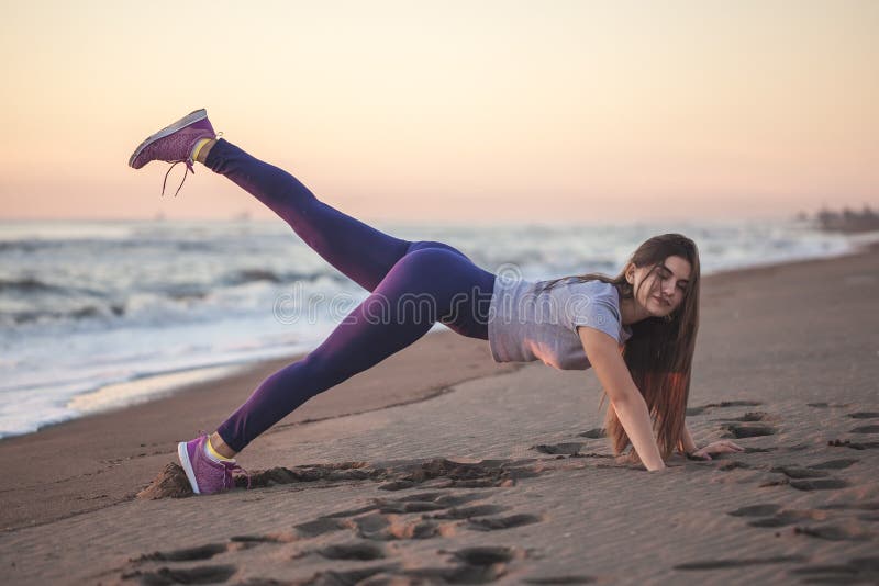 Beautiful Young Woman Doing Exercise on the Sandy Beach, Healthy Stock ...