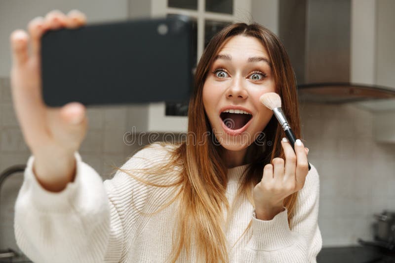 Beautiful Young Woman Doing Her Makeup at the Kitchen Stock Image ...