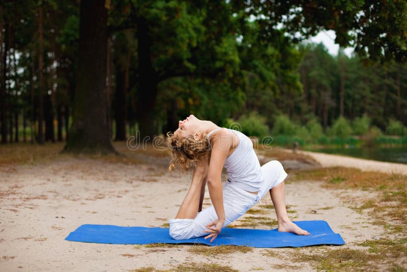 Beautiful Young Woman Doing Yoga Exercise Outdoors Stock Photo - Image ...