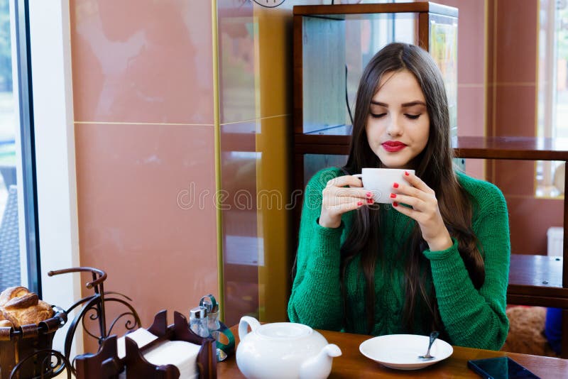 Beautiful Young Woman Drinking Tea in Cafe Stock Photo - Image of ...