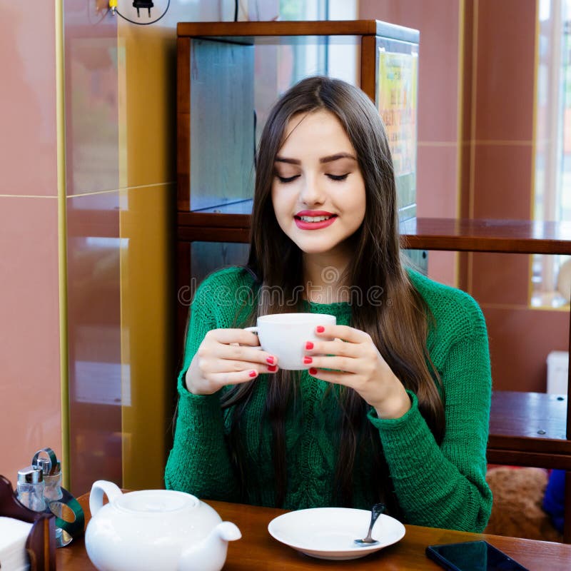 Beautiful Young Woman Drinking Tea in Cafe Stock Photo - Image of ...