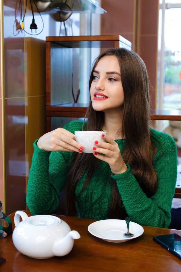 Beautiful Young Woman Drinking Tea in Cafe Stock Photo - Image of ...