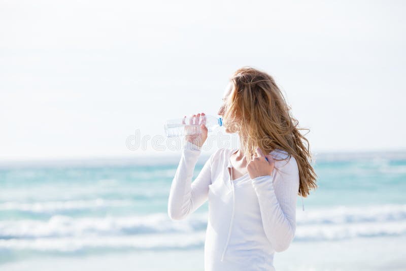 Beautiful Young Woman Drinking Water in Summer Stock Photo - Image of ...