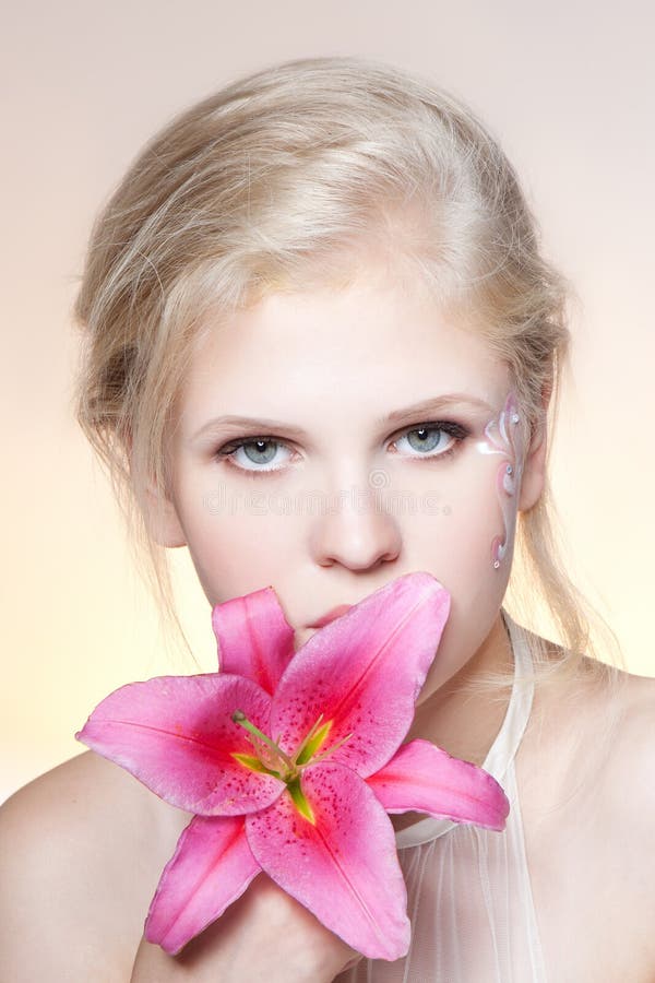 Beautiful Young Woman Face with Fresh Flower Stock Photo - Image of ...
