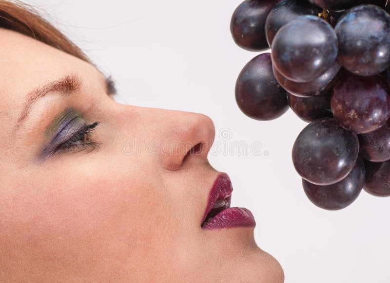 A Beautiful Young Woman Face with Grape Stock Photo - Image of hand ...
