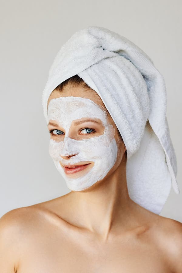 Beautiful Young Woman With Facial Mask On Her Face Skin Care And