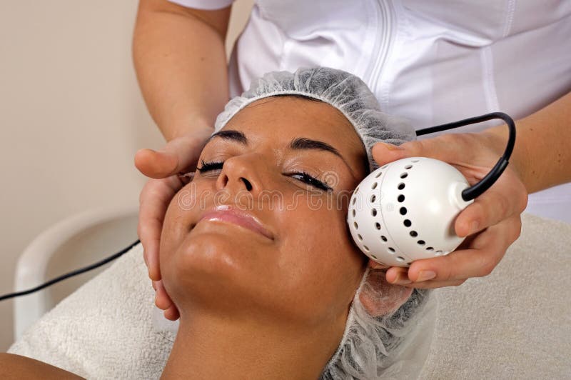 Beautiful Young Woman Getting Face Massage. Stock Photo - Image of ...