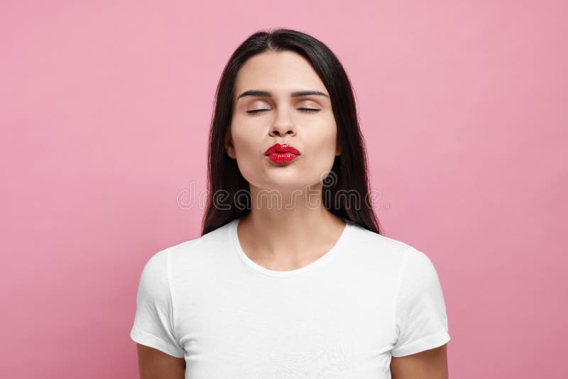 Beautiful Young Woman Giving Kiss on Pink Background Stock Image ... Beautiful Young Woman Giving Kiss on Pink Background Stock Image ...