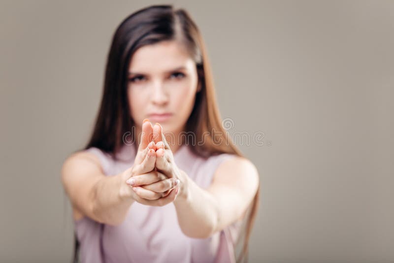 Beautiful Young Woman with Hands Pointing Like a Gun Stock Photo ...