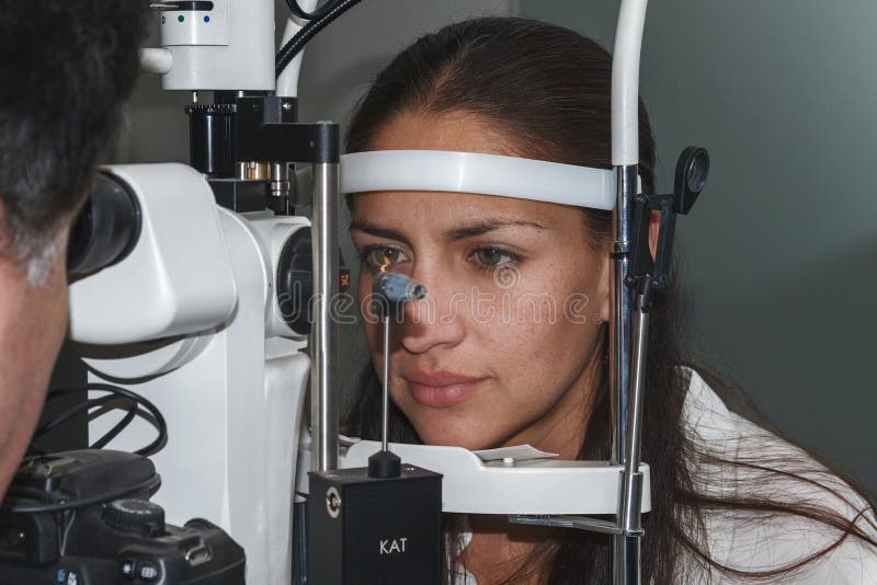 Eye Test. Optometrist Testing Woman Eyesight on Modern Equipment Stock ...