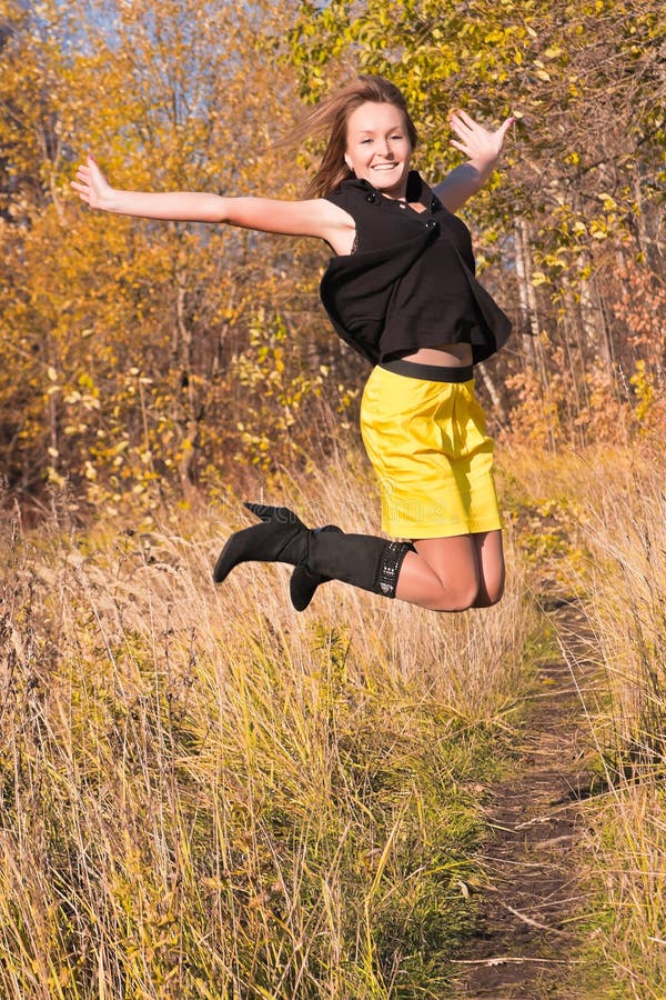 Beautiful Young Woman Jumping Stock Photo - Image of fall, dress: 16734130
