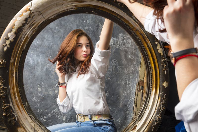 Beautiful Young Woman Looking on Her Reflection at the Mirror Stock ...