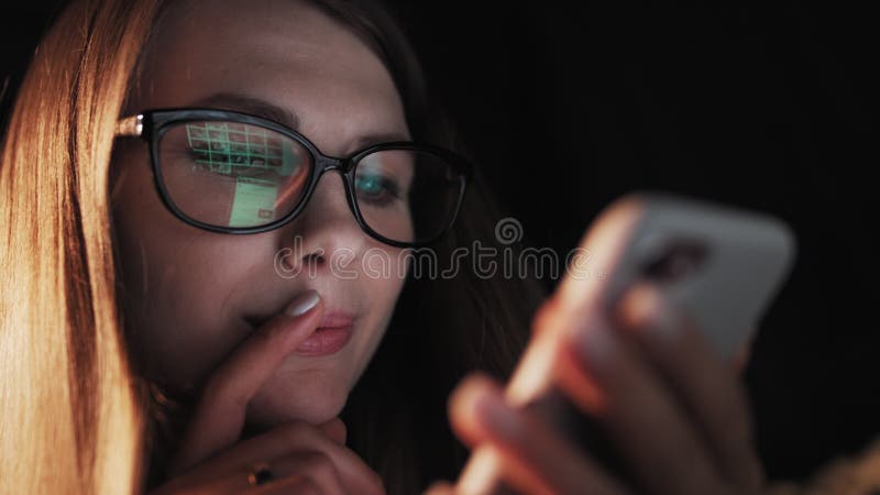 Beautiful Young Woman Lying In Bed Using Smart Phone And Smiling
