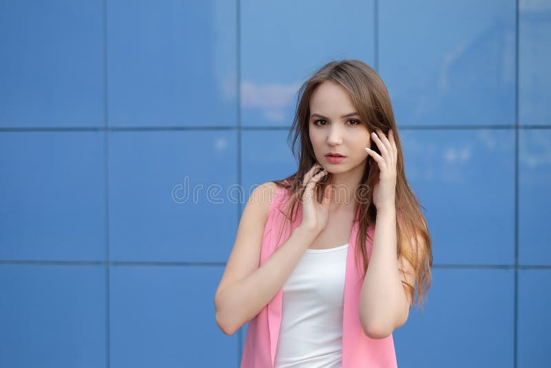 Beautiful Young Woman Posing Against a Blue Tile Background Stock Image ...