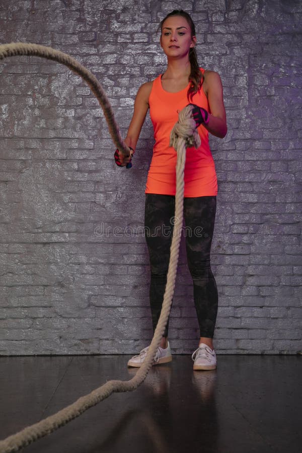 Beautiful Young Woman Practicing with a Thick Rope Stock Photo - Image ...