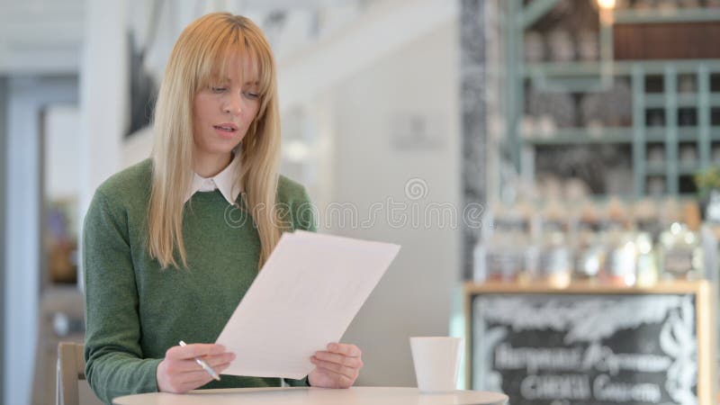 Woman Reading Documents in Cafe Stock Photo - Image of females, reading ...