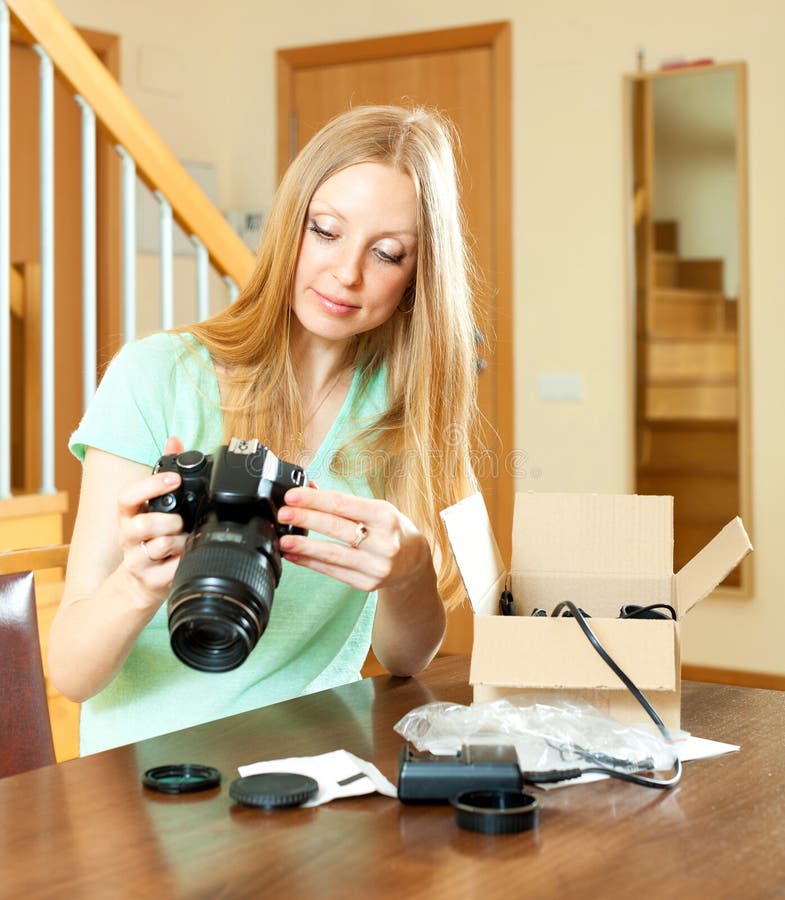 Beautiful Young Woman Reading Manual for Camera at Home Stock Image ...