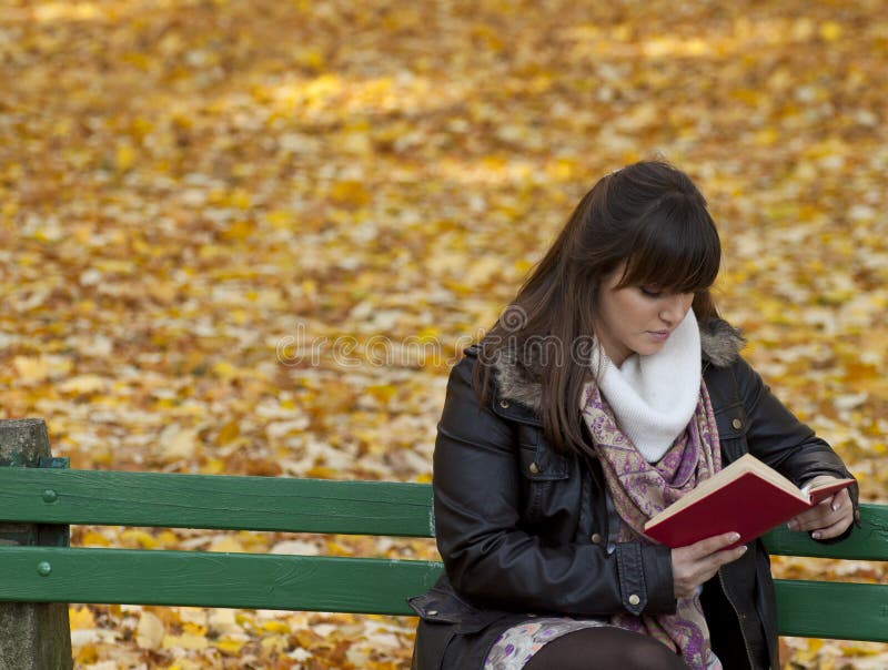 Student Girl Reading Book in the Autumn Park Stock Image - Image of ...