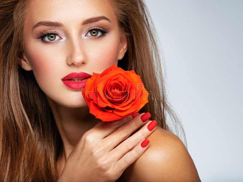 Beautiful Young Woman With A Red Flower In Hand Near Face Portrait Of
