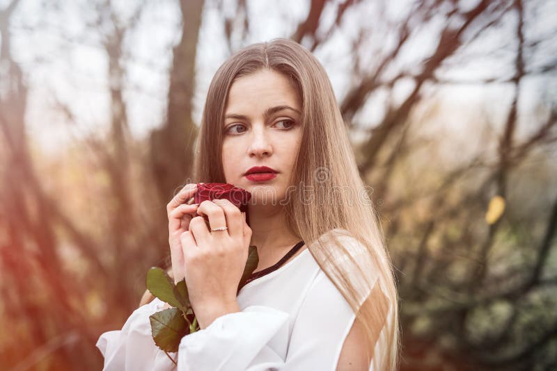 Beautiful Young Woman with Red Rose Posing Outdoors Stock Photo - Image ...