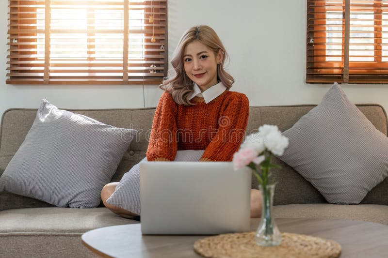 Beautiful Young Woman Relaxing on a Couch at Home Stock Image - Image ...