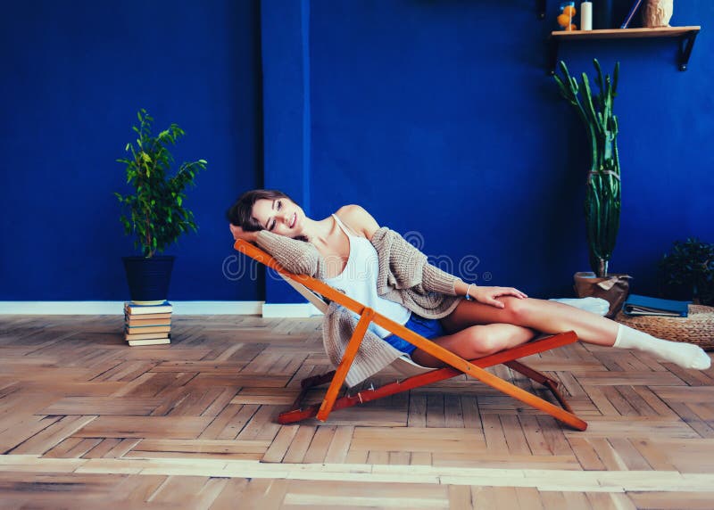 Woman resting in the chair stock image. Image of girl - 132857357