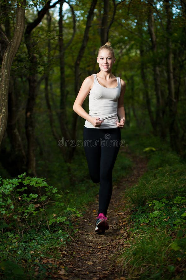 Beautiful Young Woman Runs in Forest - Active Runner Running Stock ...