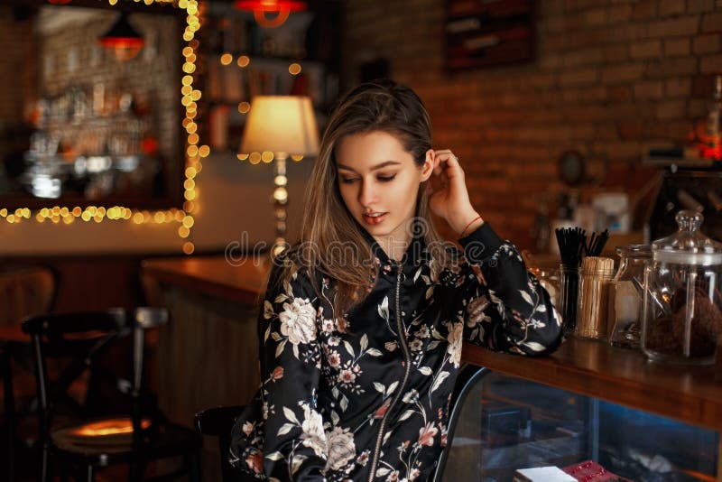 Beautiful Young Woman Sits at a Bar in a Restaurant Stock Photo - Image ...