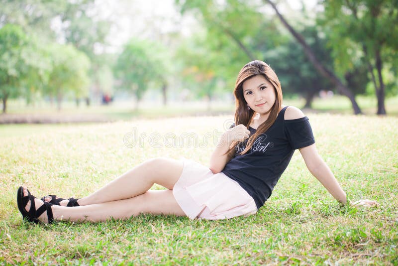 Beautiful Young Woman Sitting on Grass Stock Image - Image of adult ...