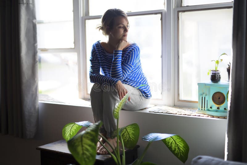 Beautiful Young Woman Sitting Near Window Stock Photo - Image of legs ...