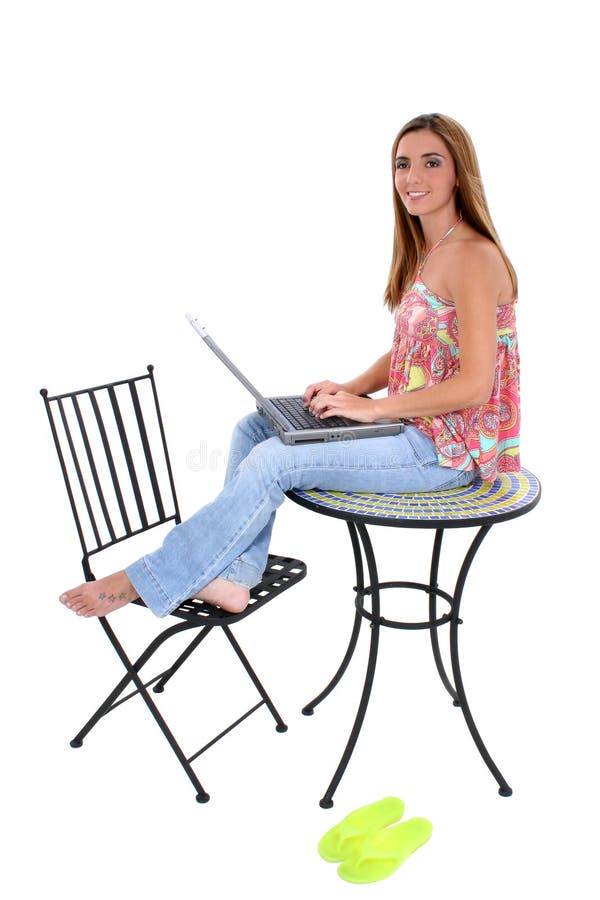 Beautiful Young Woman Sitting on Table Working on Laptop Stock Photo ...