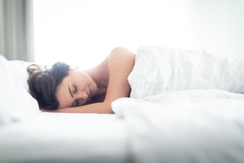 Young Woman Sleeping in Bed Stock Image - Image of face, nightie: 211172547
