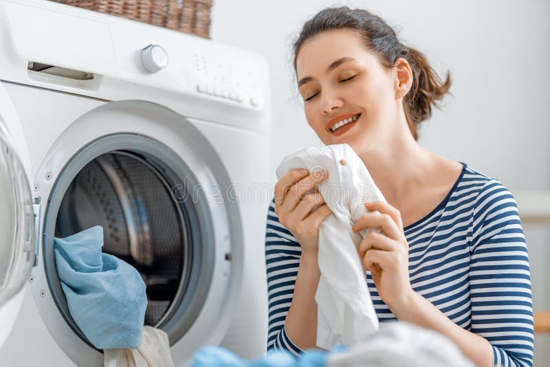 Woman is doing laundry stock photo. Image of house, indoor - 198037716