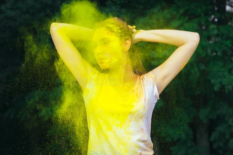 Beautiful Young Woman Standing in a Cloud of Dry Paint Stock Photo ...