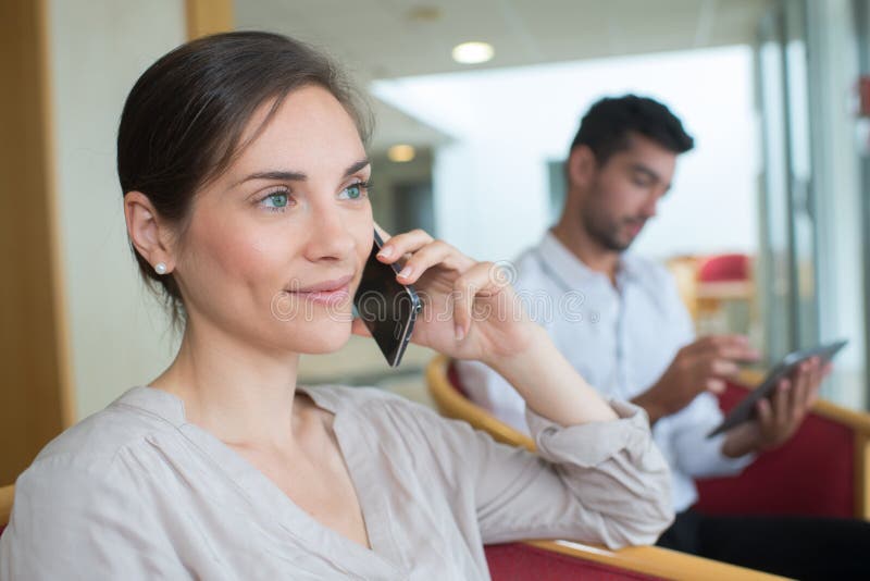 Beautiful Young Woman Talking by Telephone in Office Stock Photo ...