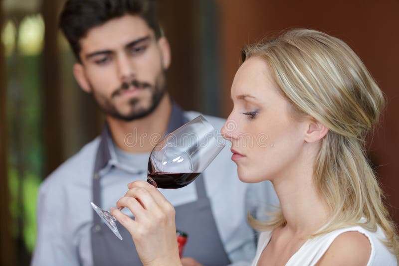 Beautiful Young Woman Tasting Wine in Restaurant Stock Photo - Image of ...