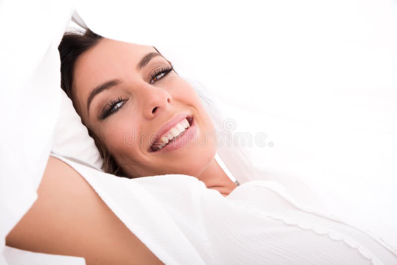 A Beautiful Young Woman Under the Sheets in the Bed Stock Image - Image ...