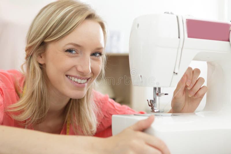 Beautiful Young Woman Using Electric Sewing Machine Stock Image - Image ...