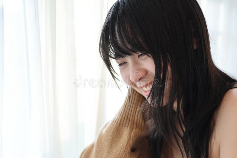 Beautiful Young Woman Waking Up In The Morning At White Bedroom Stock